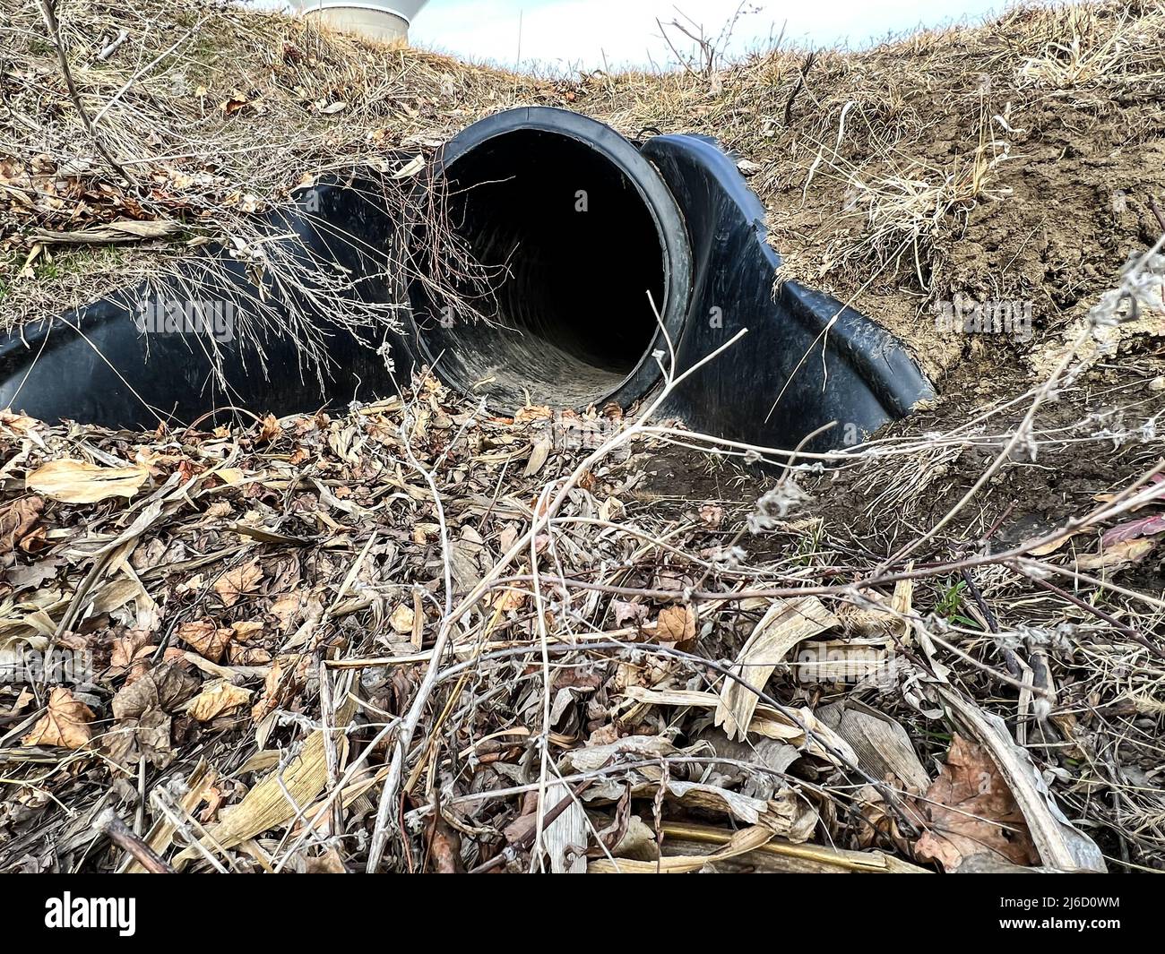 HDPE drainage culvert under a road entrance. Pipe is used to convey ...