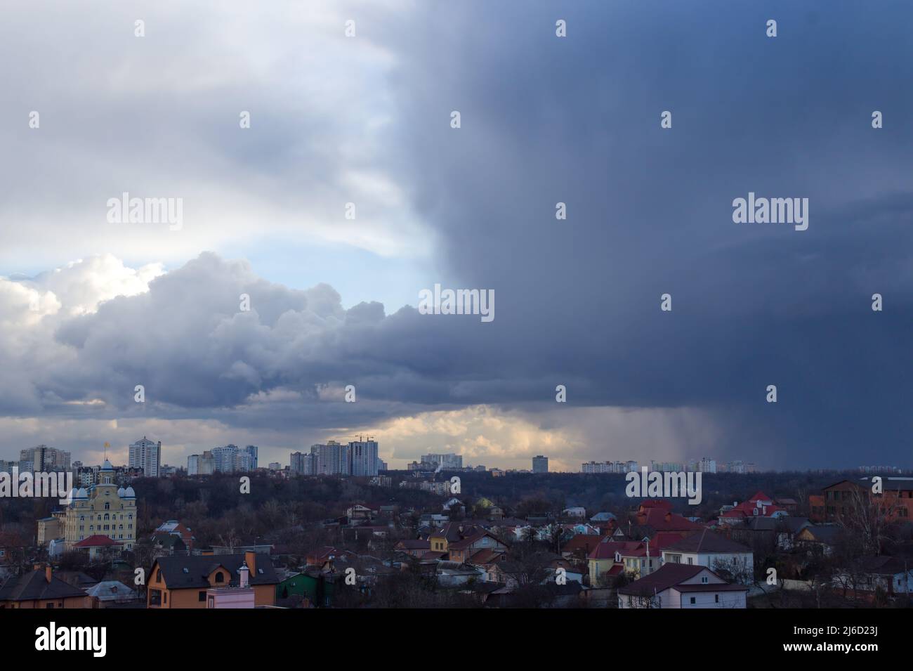 dark thundercloud over the outskirts of the city, summer, atmospheric ...