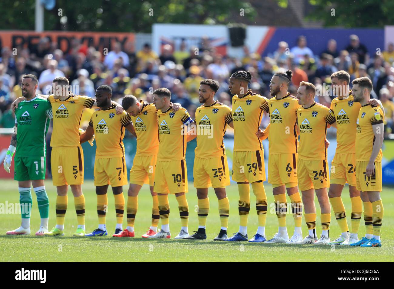 Sutton United players stand together as a sign of unity instead of ...