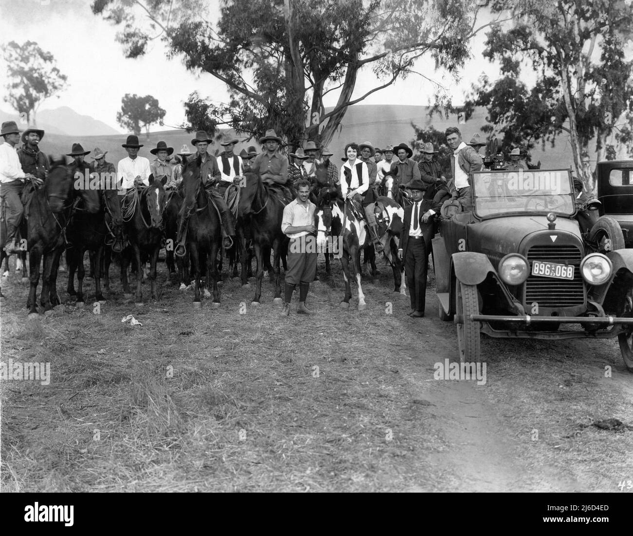 Director TOM GIBSON holding horse of HAZEL KEENER on set location ...