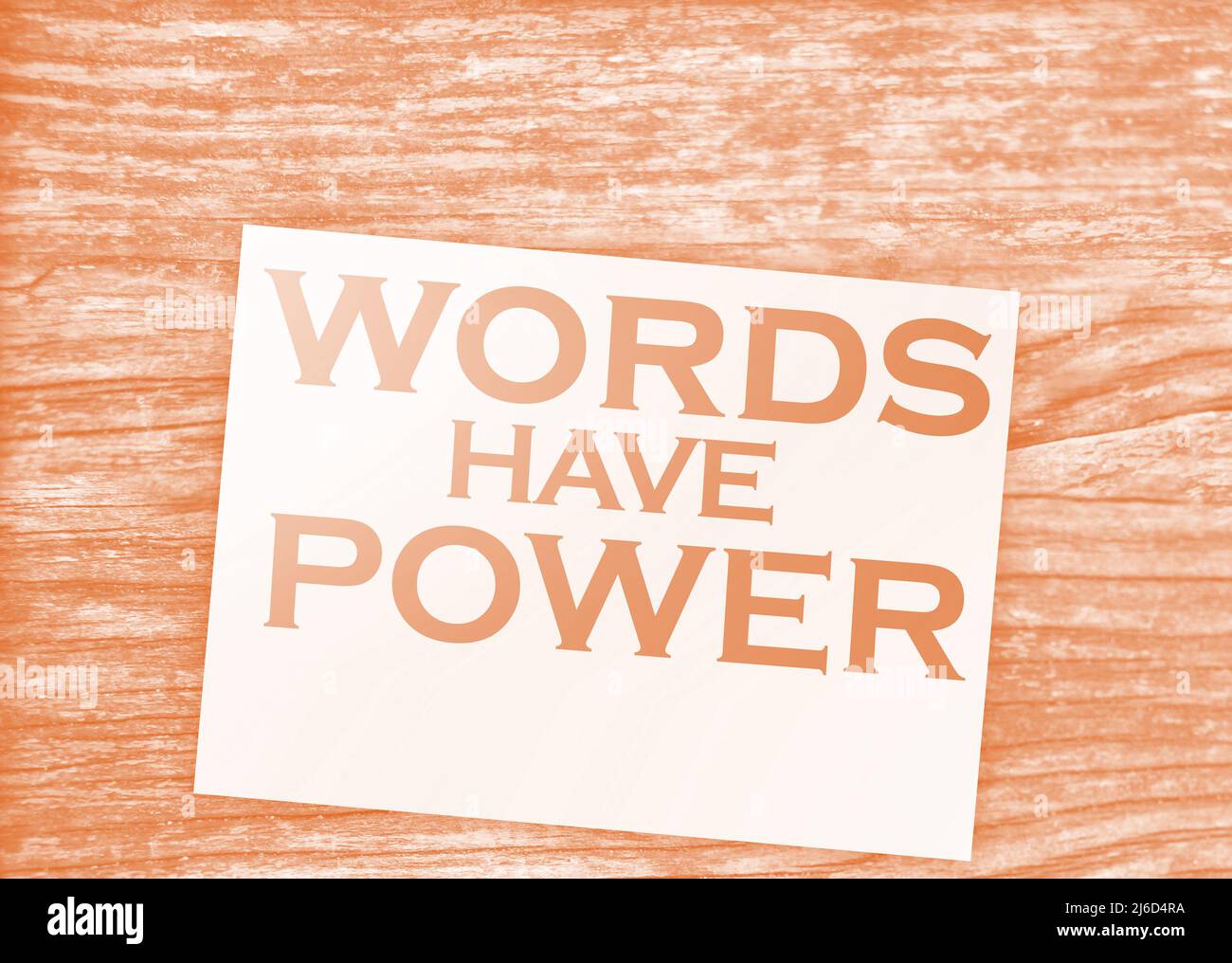 Words have power text on page and paper dollar signs around on wooden ...