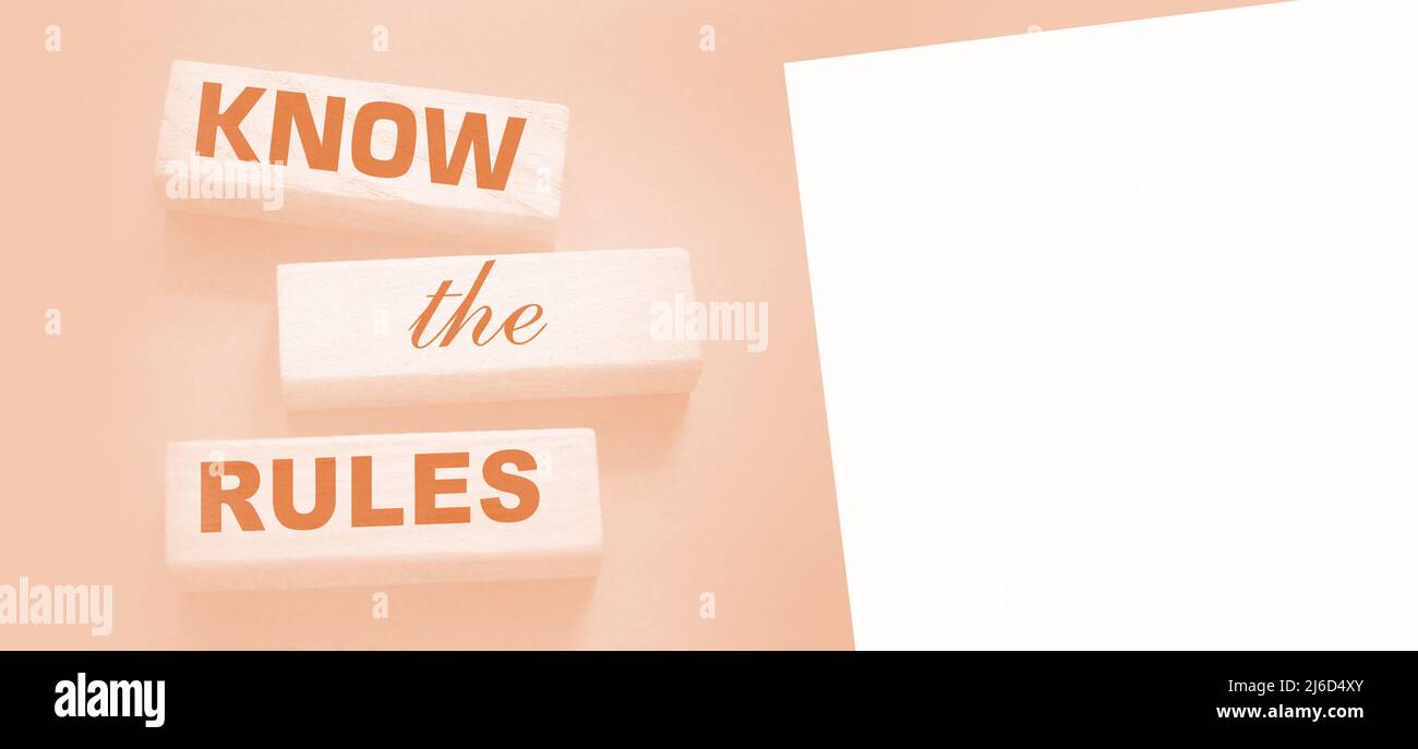 Know the rules word on wooden blocks isolated on dark grey background ...