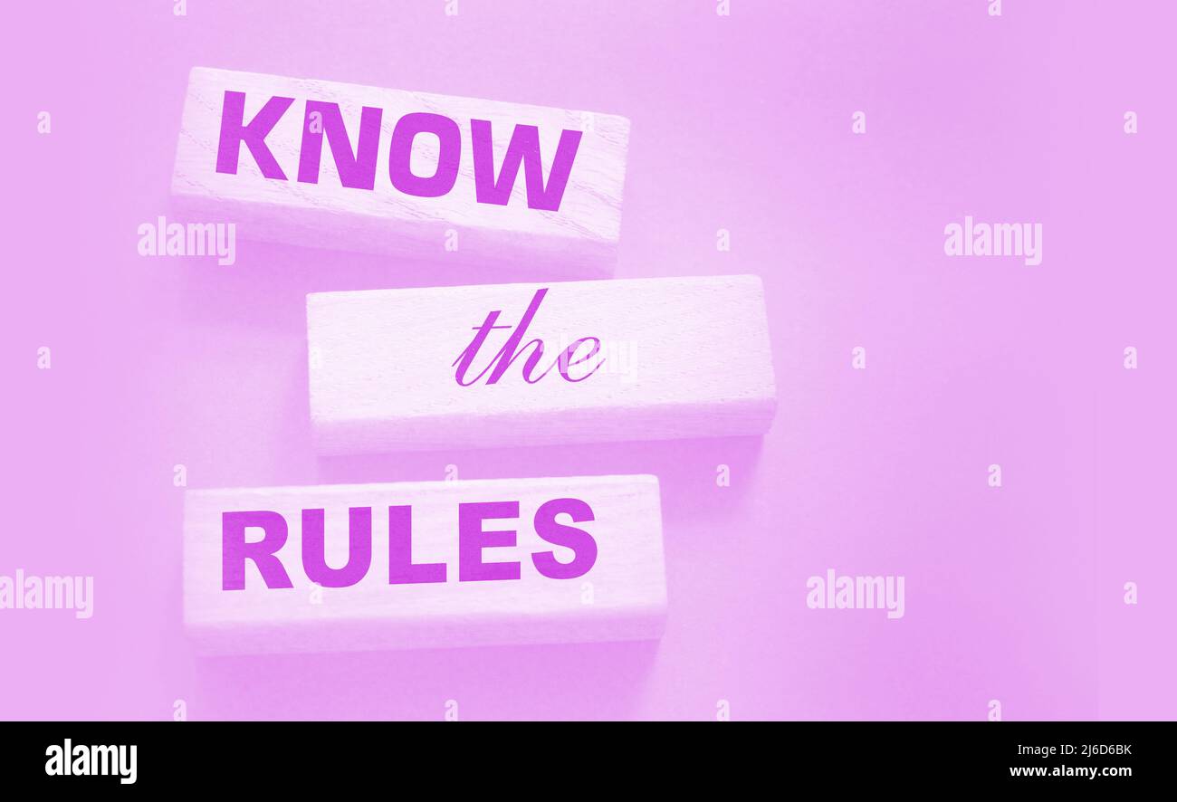 Know the rules word on wooden blocks isolated on dark grey background ...