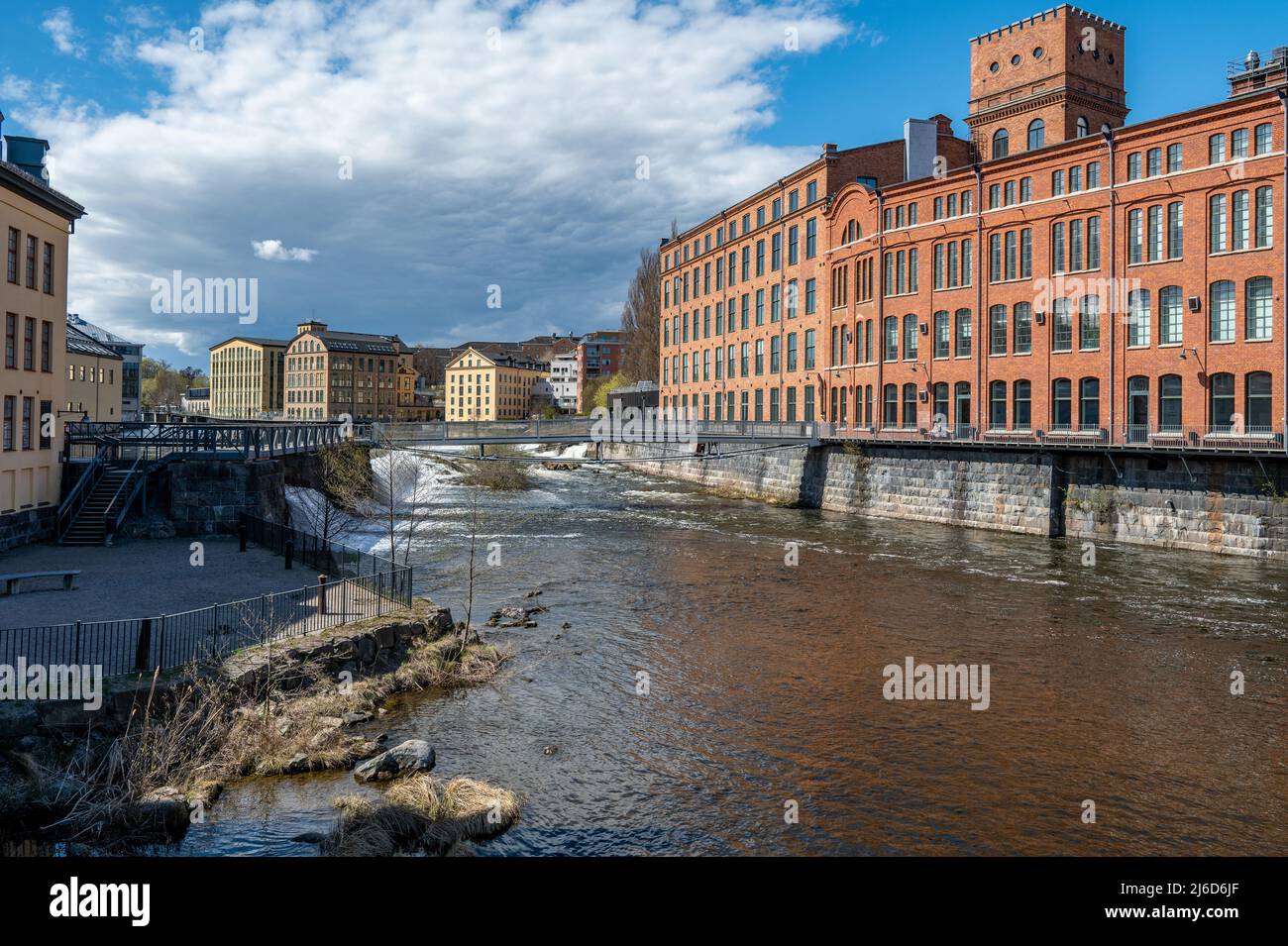 The historic industrial landscape and Motala river in Norrköping ...