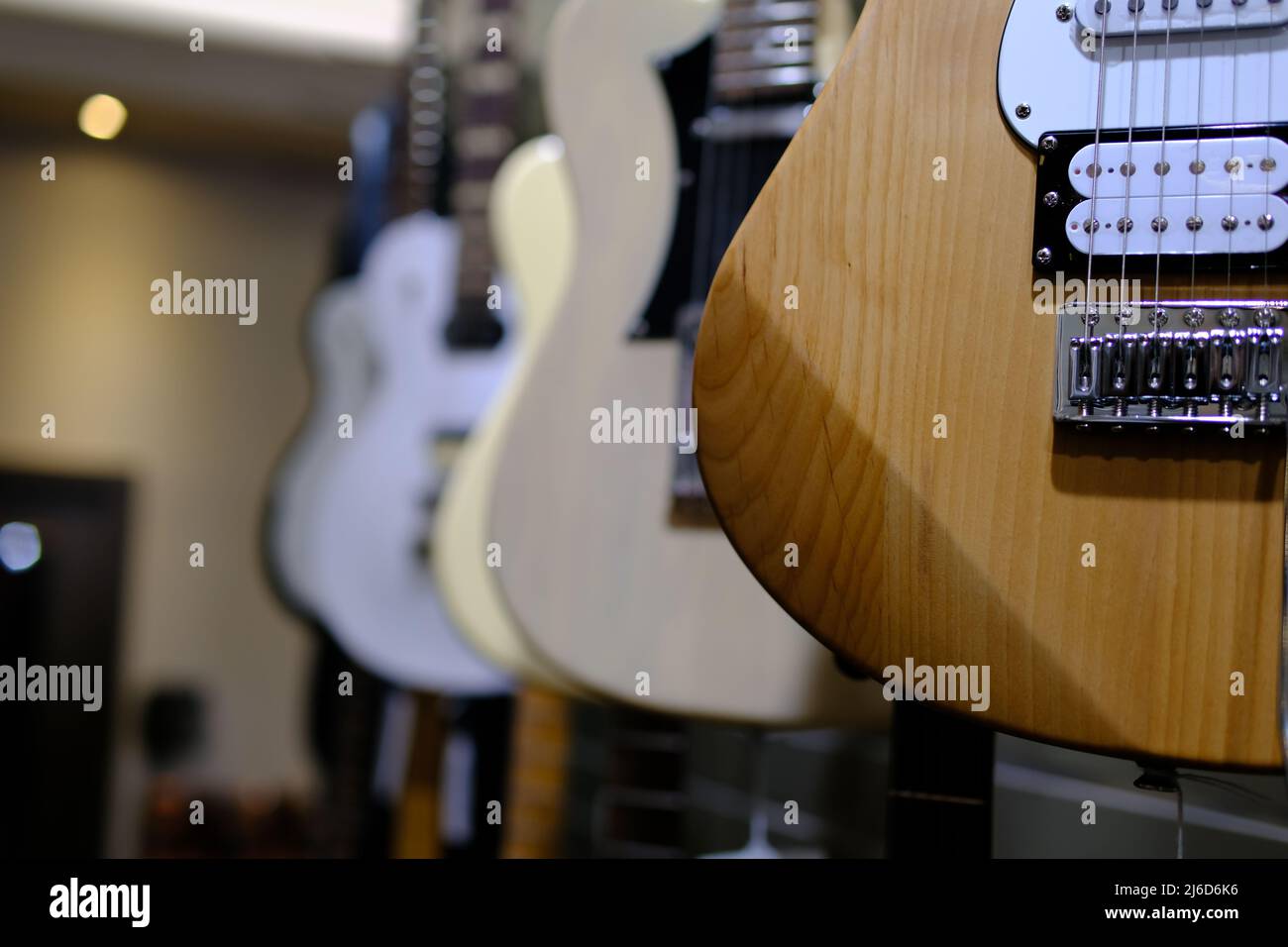 Guitars on display in music instruments store in a mall Stock Photo - Alamy