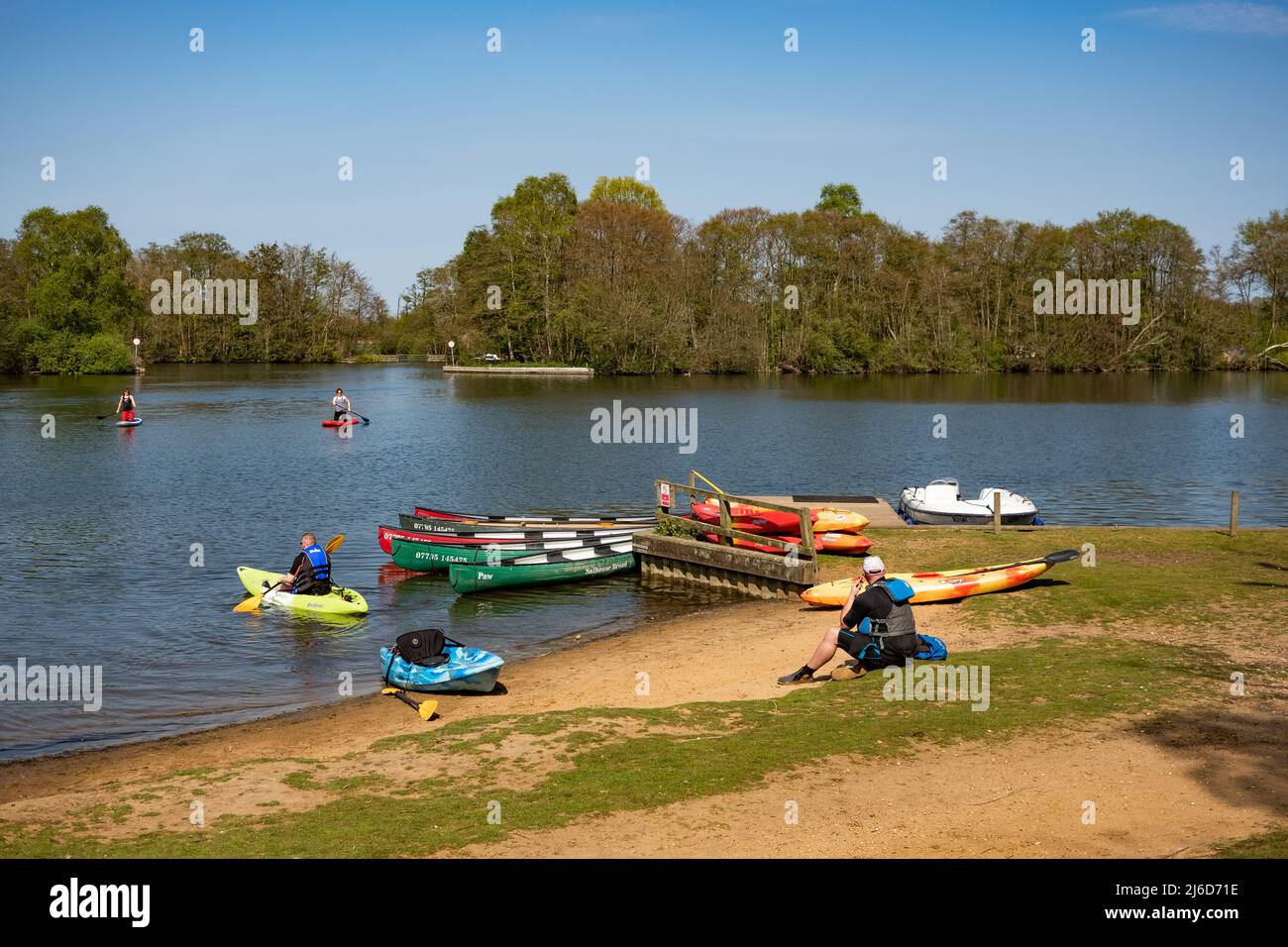 Canoeists and paddleboarders on Salhouse Broad in the heart of the ...