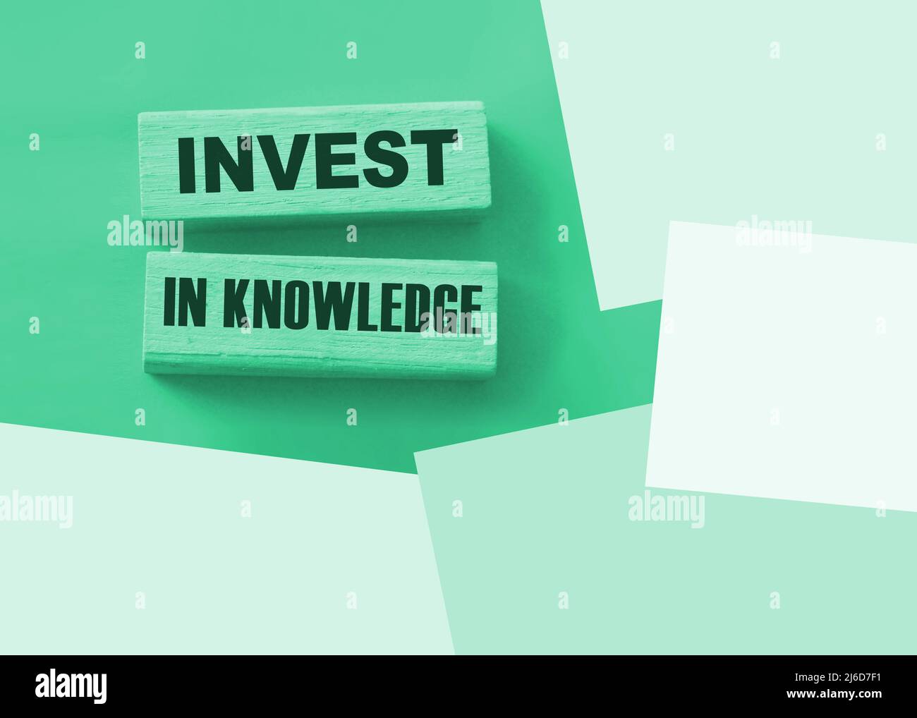 Investing In Knowledge words on wooden blocks. Education concept Stock ...