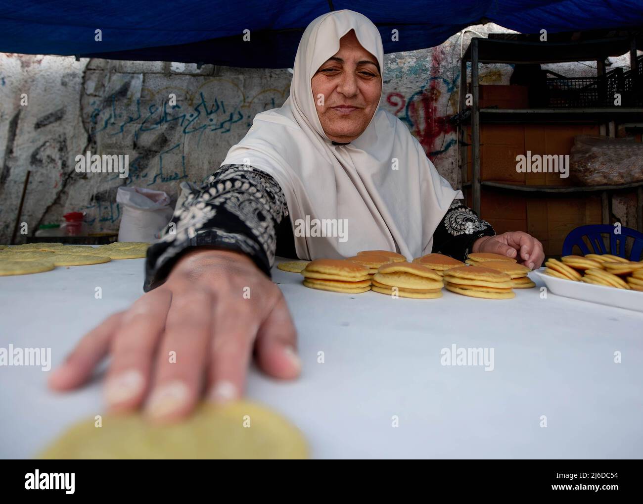 Palestinian Mariam Salha, 58, makes and sells traditional sweets called ...