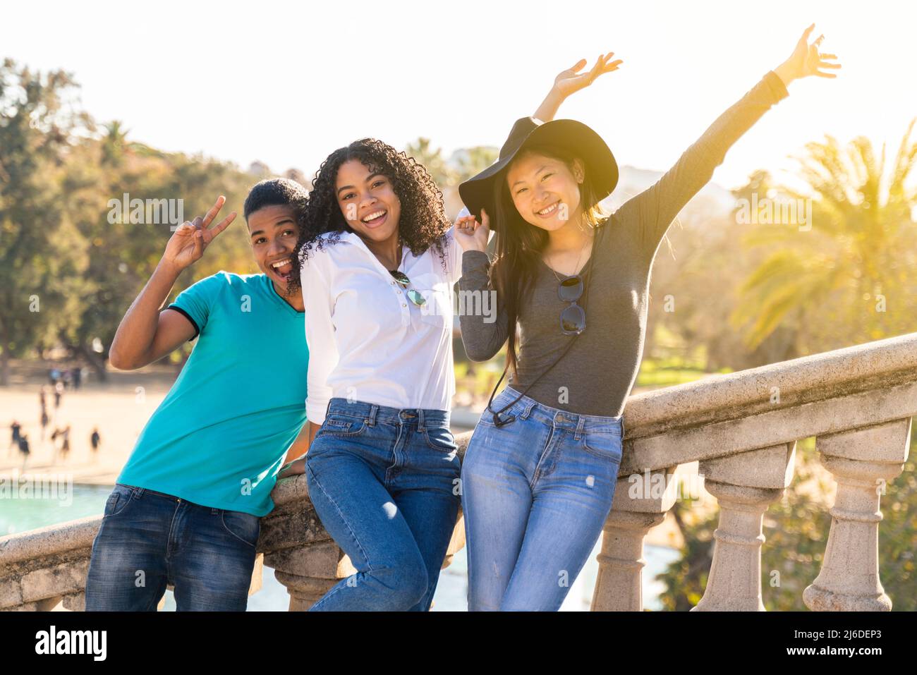 Group of multiracial young friends on vacation visiting a landmark ...