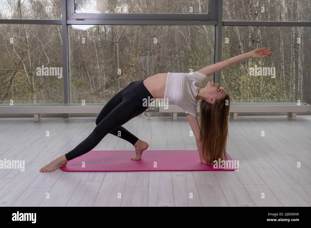 An out mat exercise the on in the stretched girl during the day fitness ...
