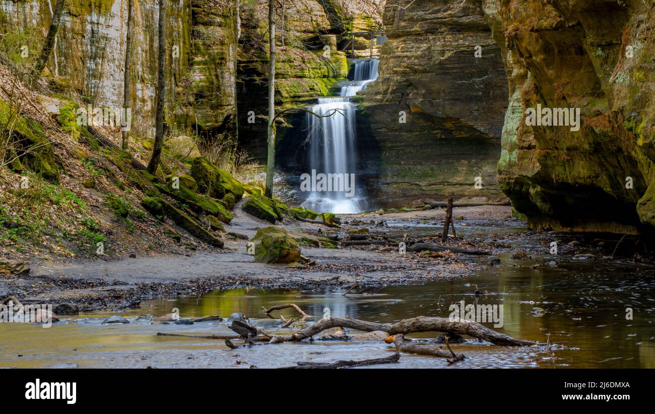 A Beautiful long exposure waterfall in a mossy landscaped slate canyon ...