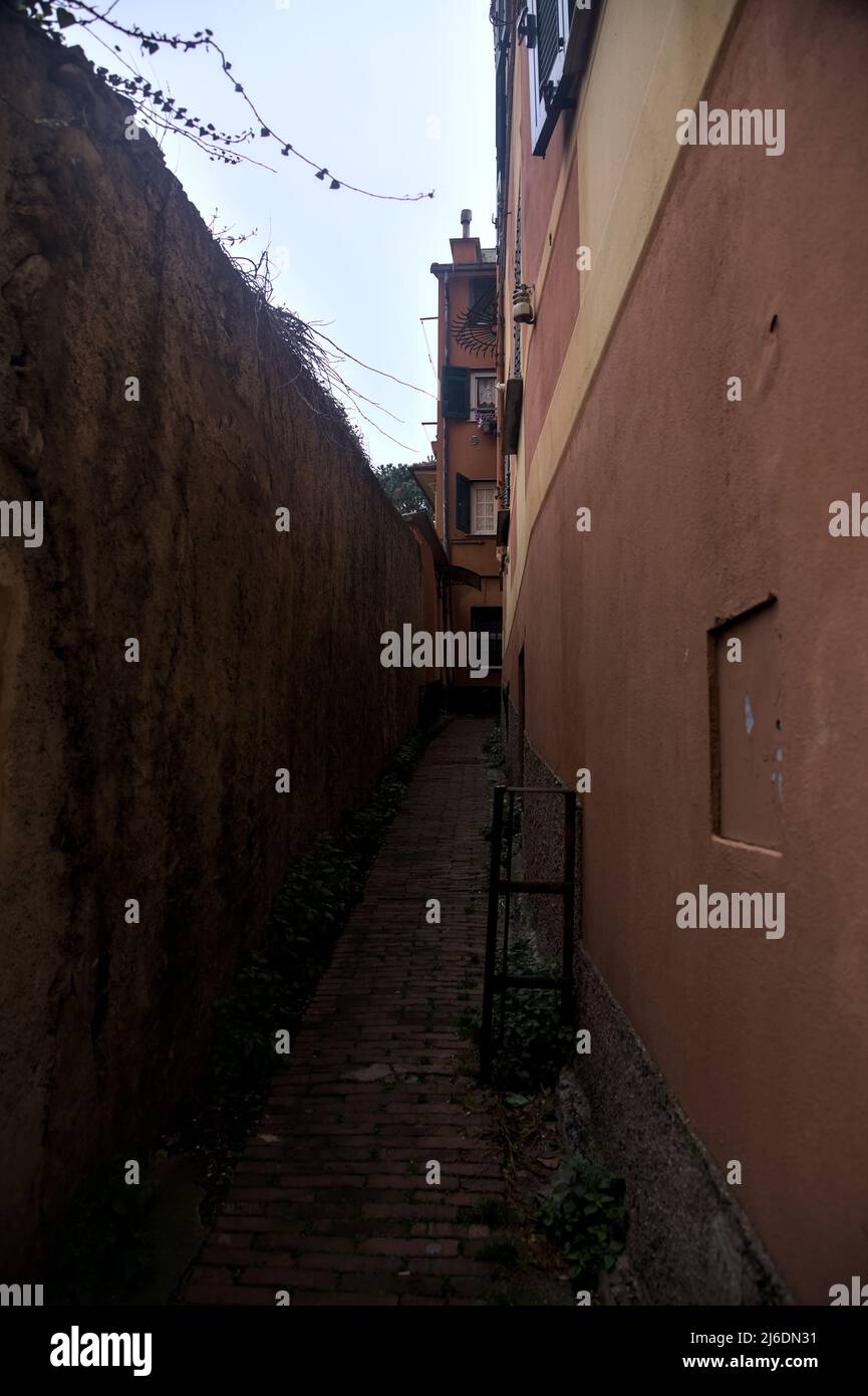 Narrow alley at the entrance of a building at dusk Stock Photo - Alamy