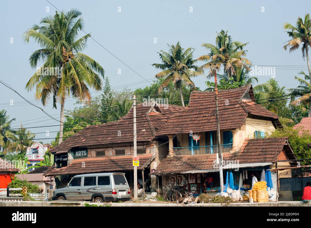 Traditional tiled roof houses and shops on market road of Alappuzha ...