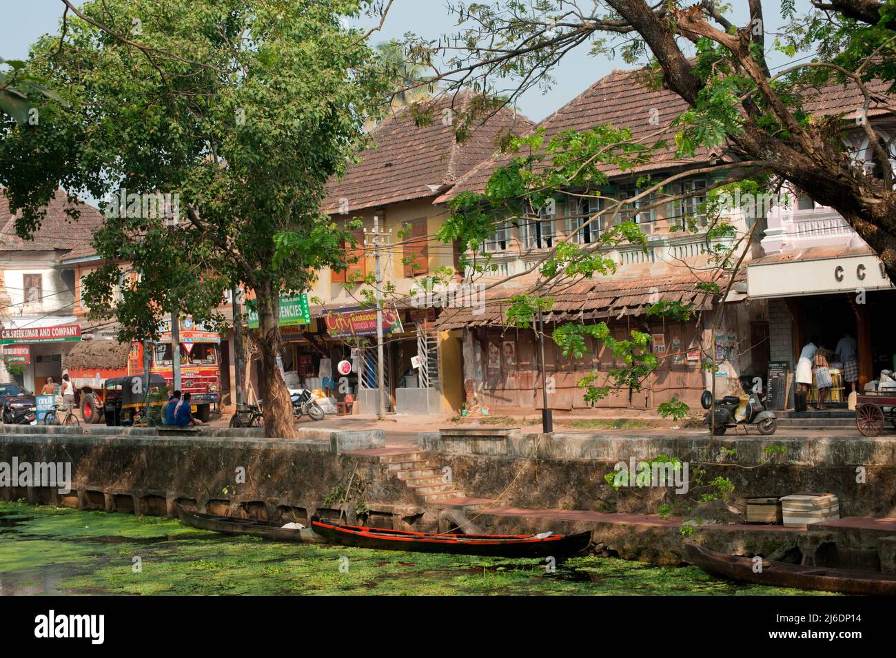 Traditional tiled roof houses and shops on market road of Alappuzha ...