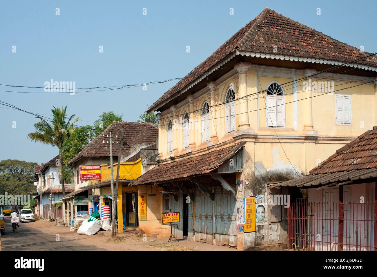 Traditional tiled roof houses and shops on market road of Alappuzha ...