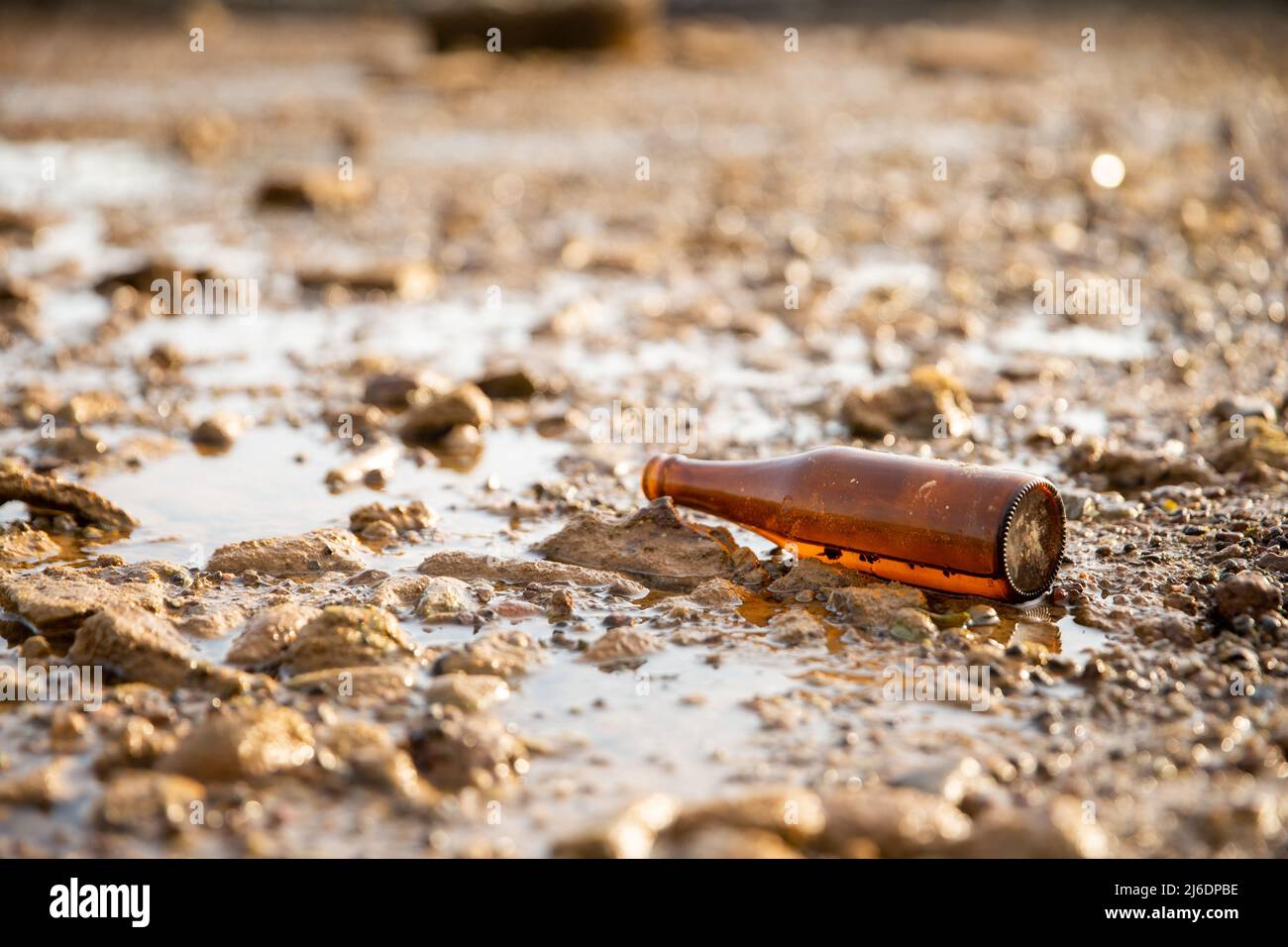 Bottled water washed away by seawater, marine debris Stock Photo - Alamy