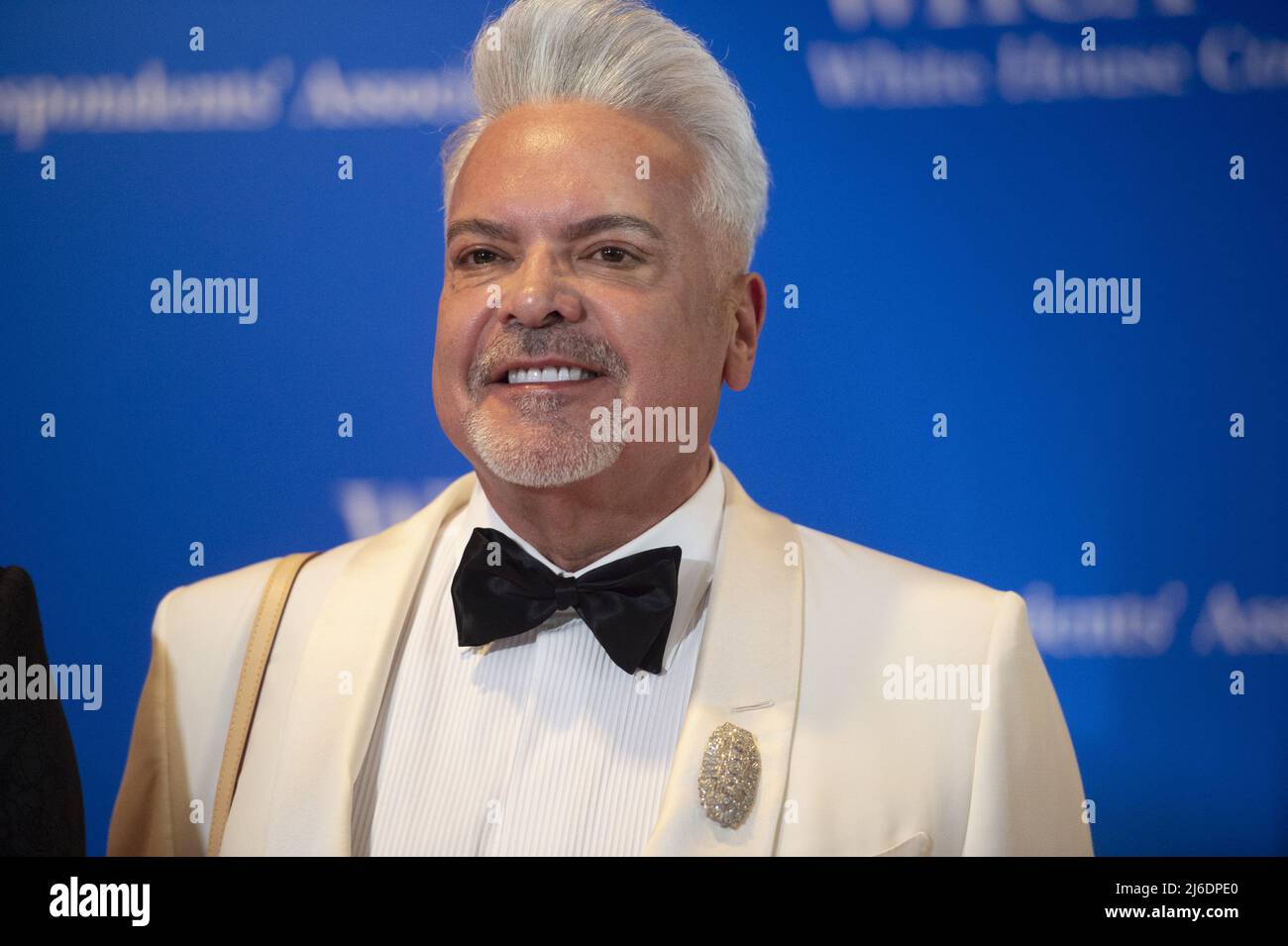 Activist Henry R. Muñoz III (C) arrives at the 2022 White House ...