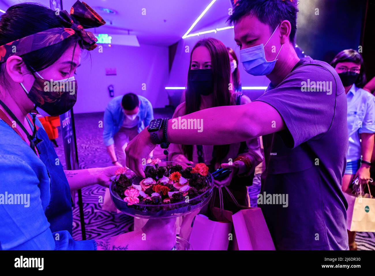 Moviegoers try vegan desserts on their way out of a movie premiere at ...