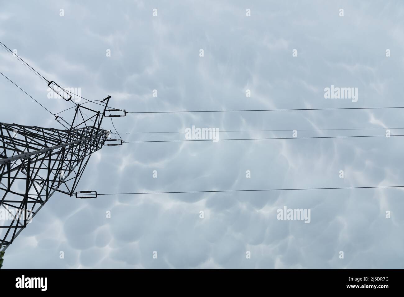 Pole for overhead transmission of eclectic power against a background ...