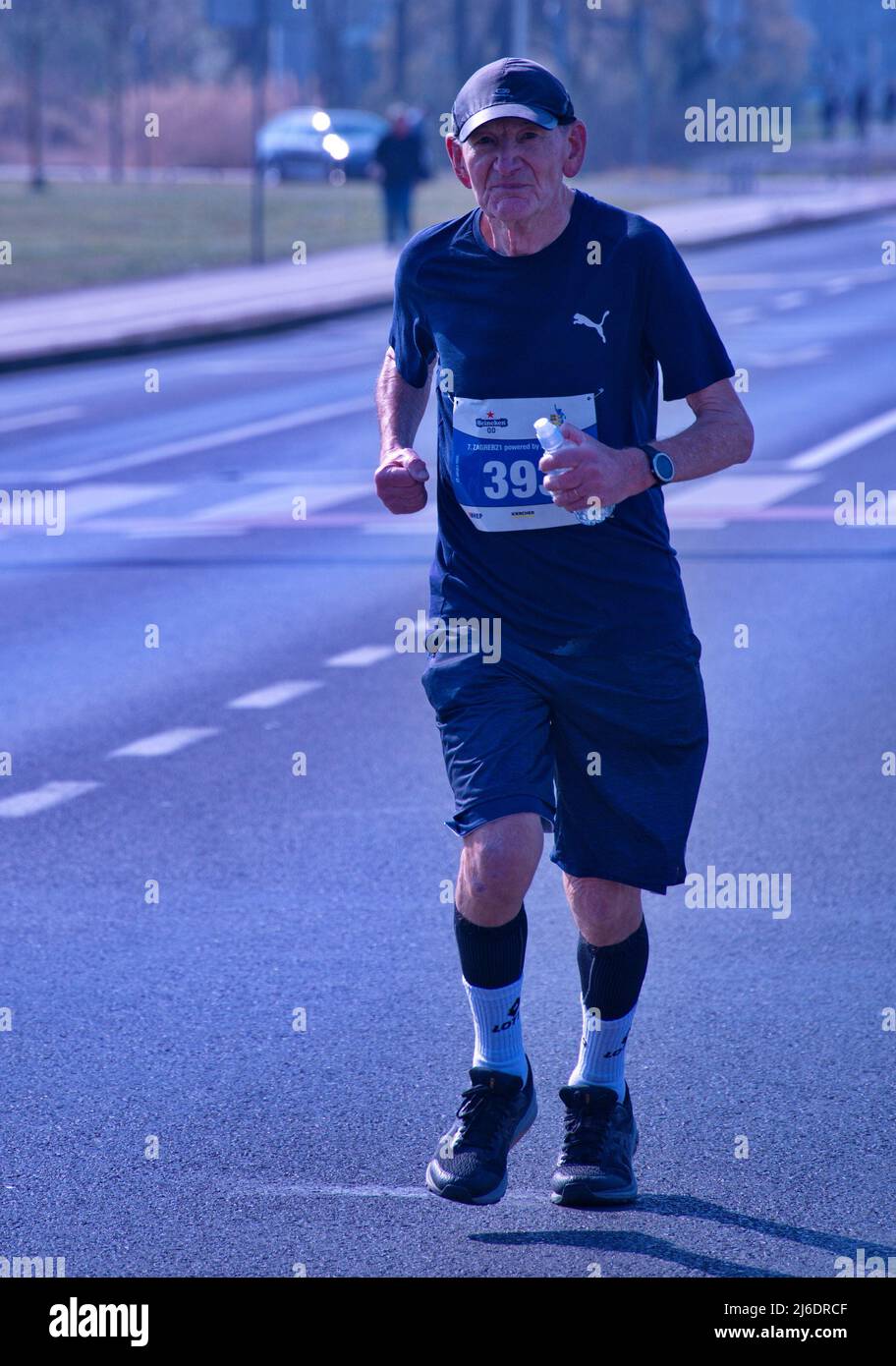 Active senior man running marathon Stock Photo - Alamy