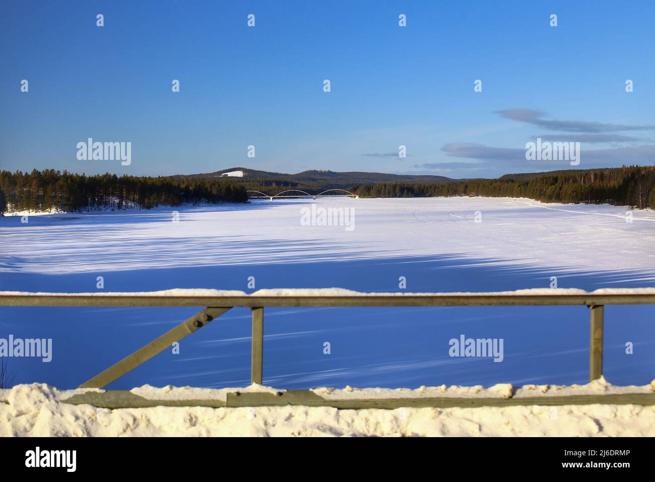 Winterly view from a bridge crossing Vindel river in northern Sweden ...