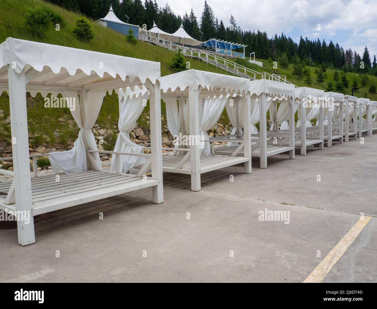Empty sun loungers stand under a canopy Stock Photo - Alamy