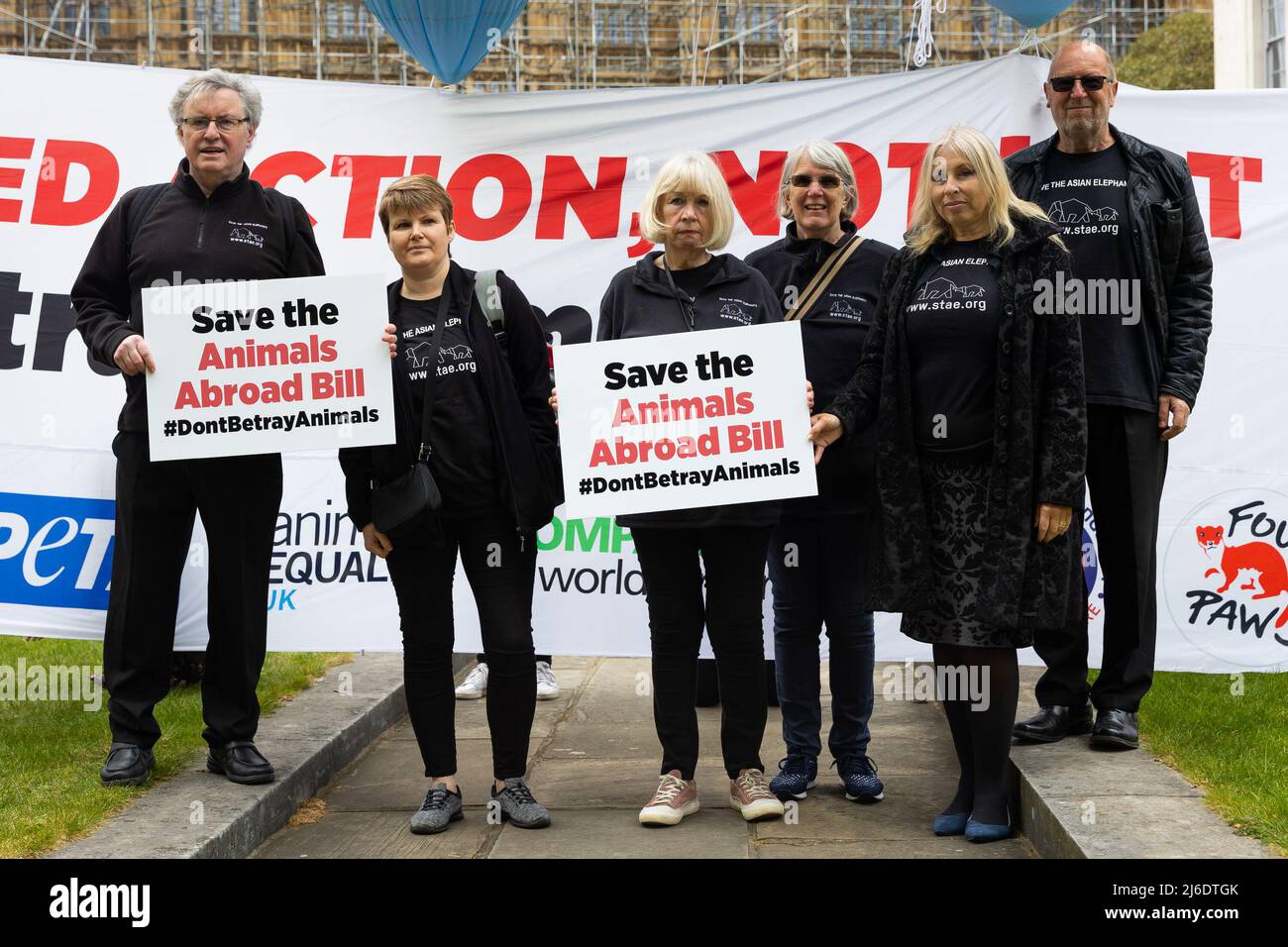 Protestors hold placards supporting animal rights on Parliament Square ...