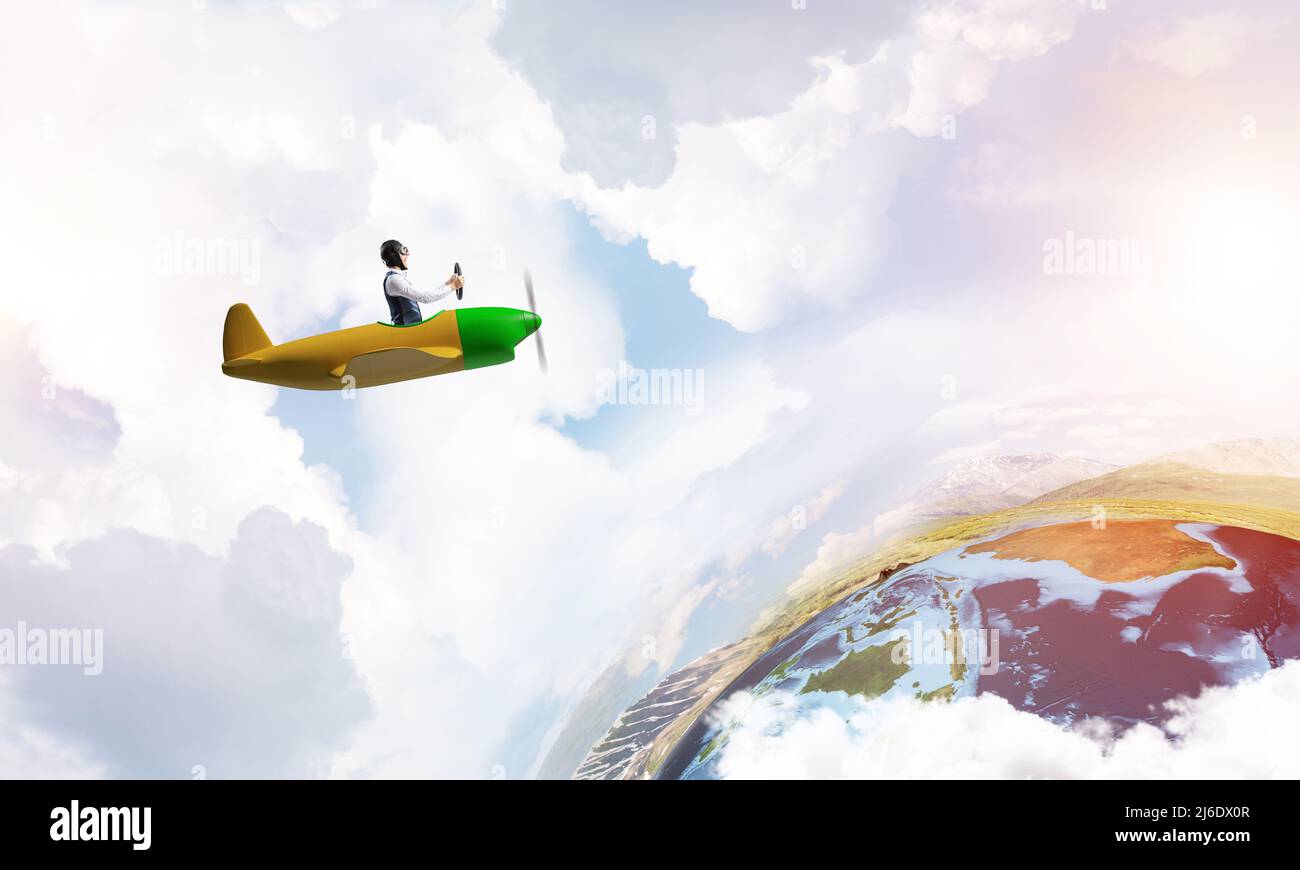 Happy pilot driving small propeller plane Stock Photo - Alamy