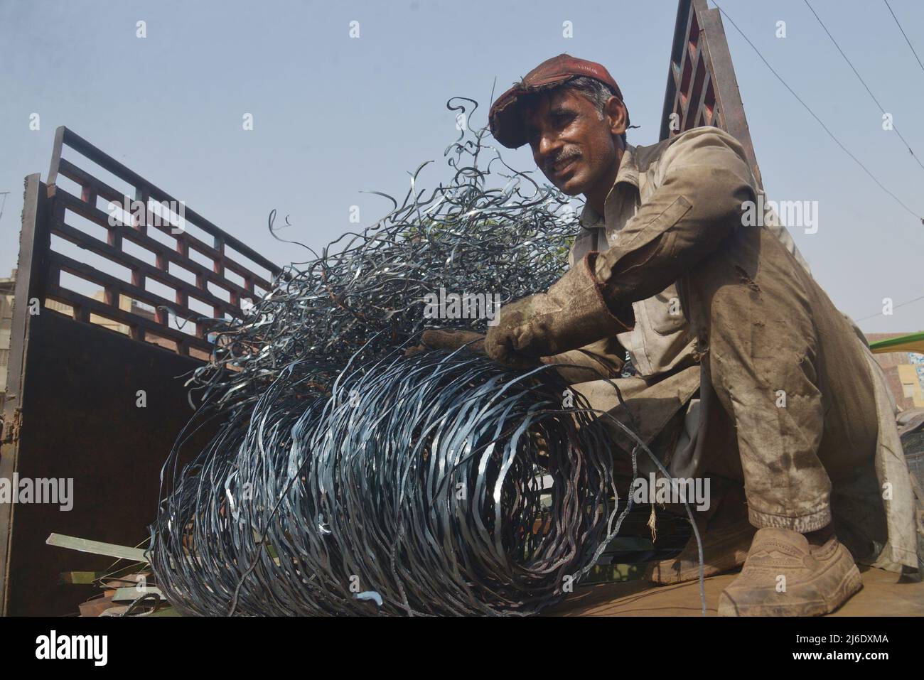 Pakistani laborers are busy in routine work at their workspace during ...