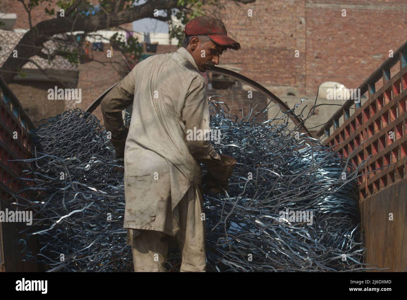 Pakistani laborers are busy in routine work at their workspace during ...