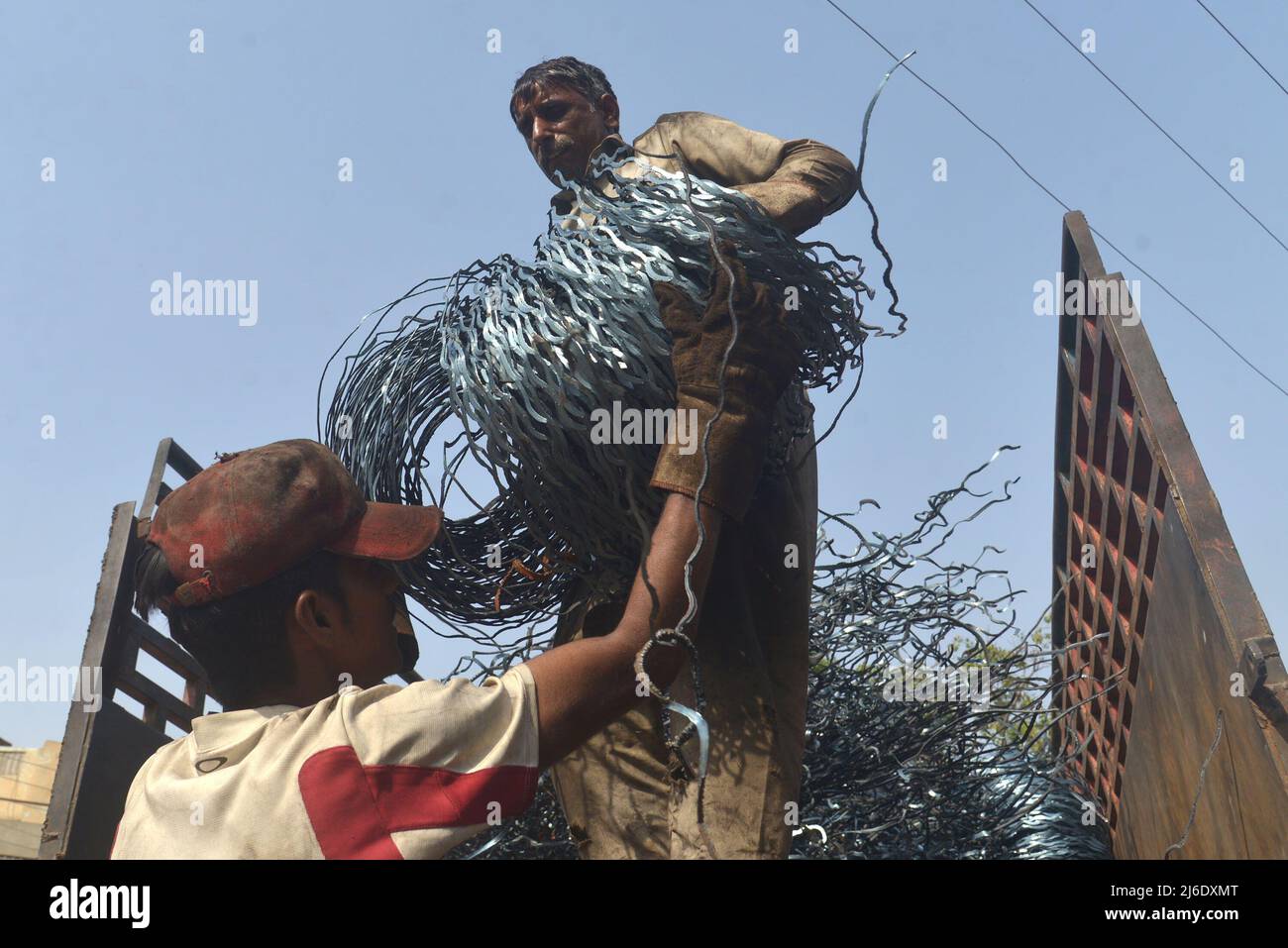 Pakistani laborers are busy in routine work at their workspace during ...