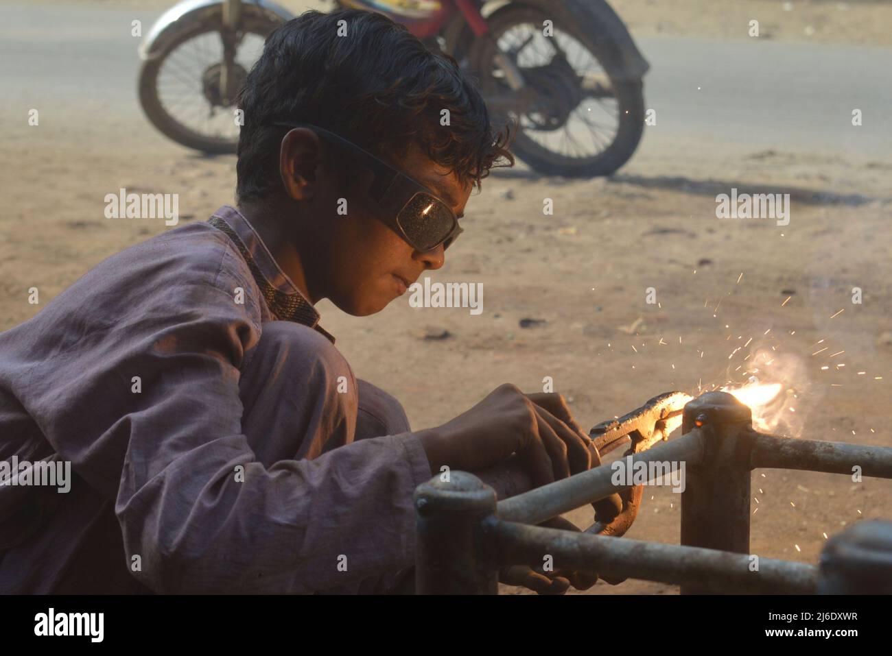 Pakistani laborers are busy in routine work at their workspace during ...
