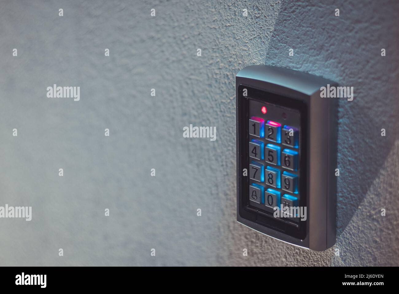 Side view of modern digital combination access lock, illuminated keys ...