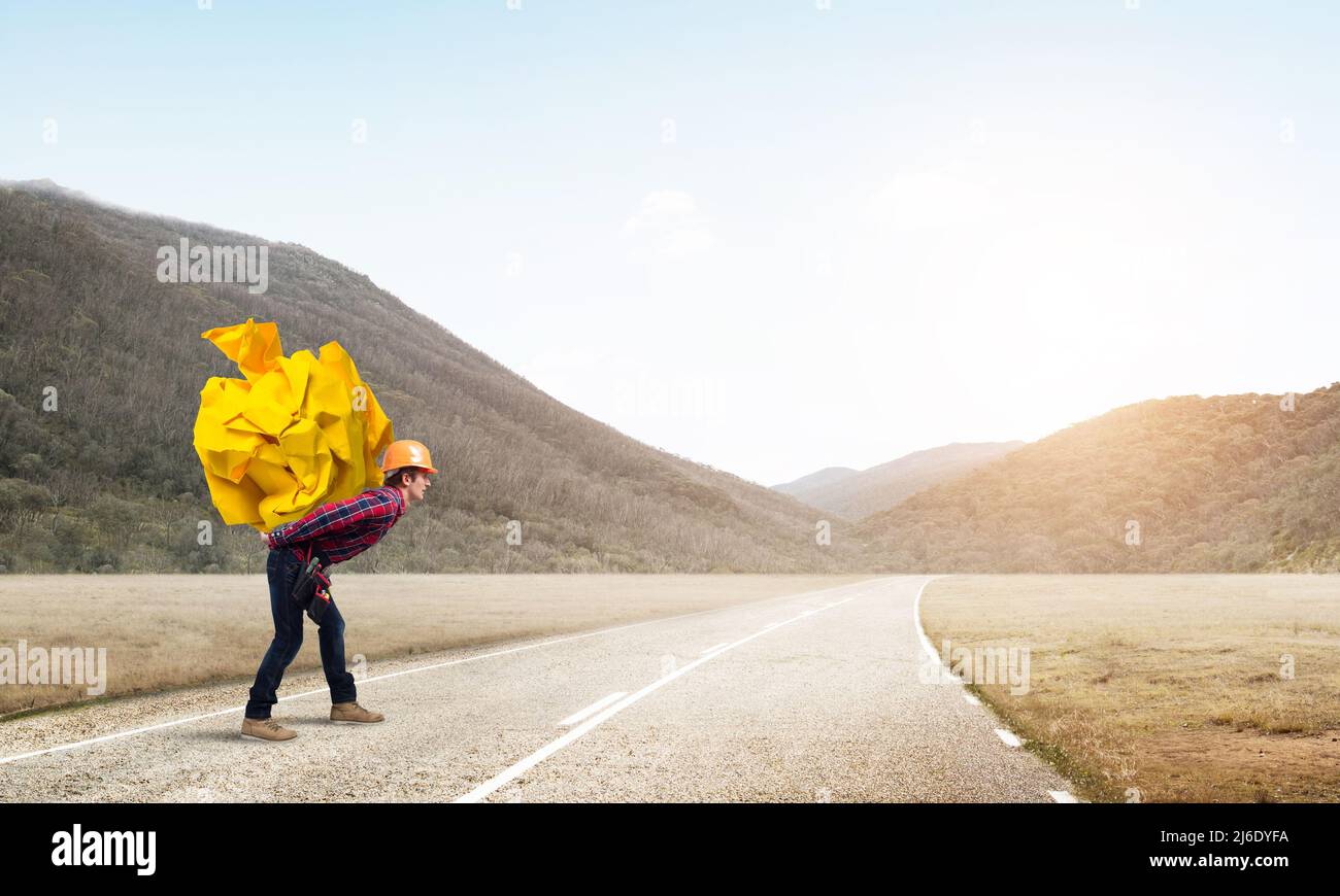 Engineer man carry load Stock Photo - Alamy