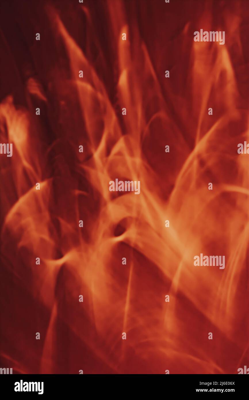 Bright red flames on black, abstract background. Vertical banner ...