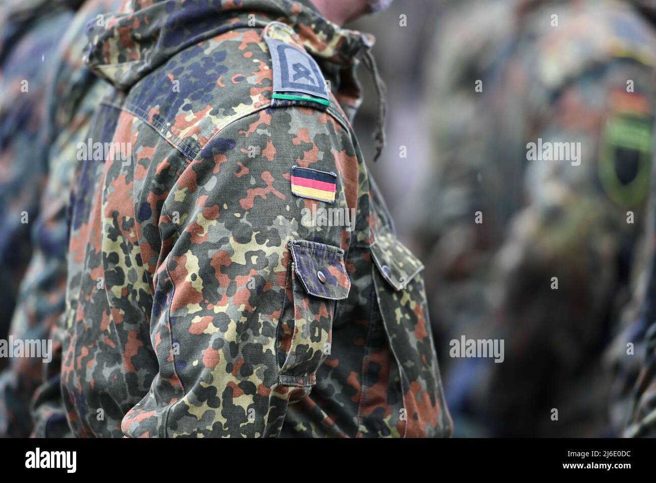 30 April 2022, Bavaria, Munich: The German flag on the uniform of a ...