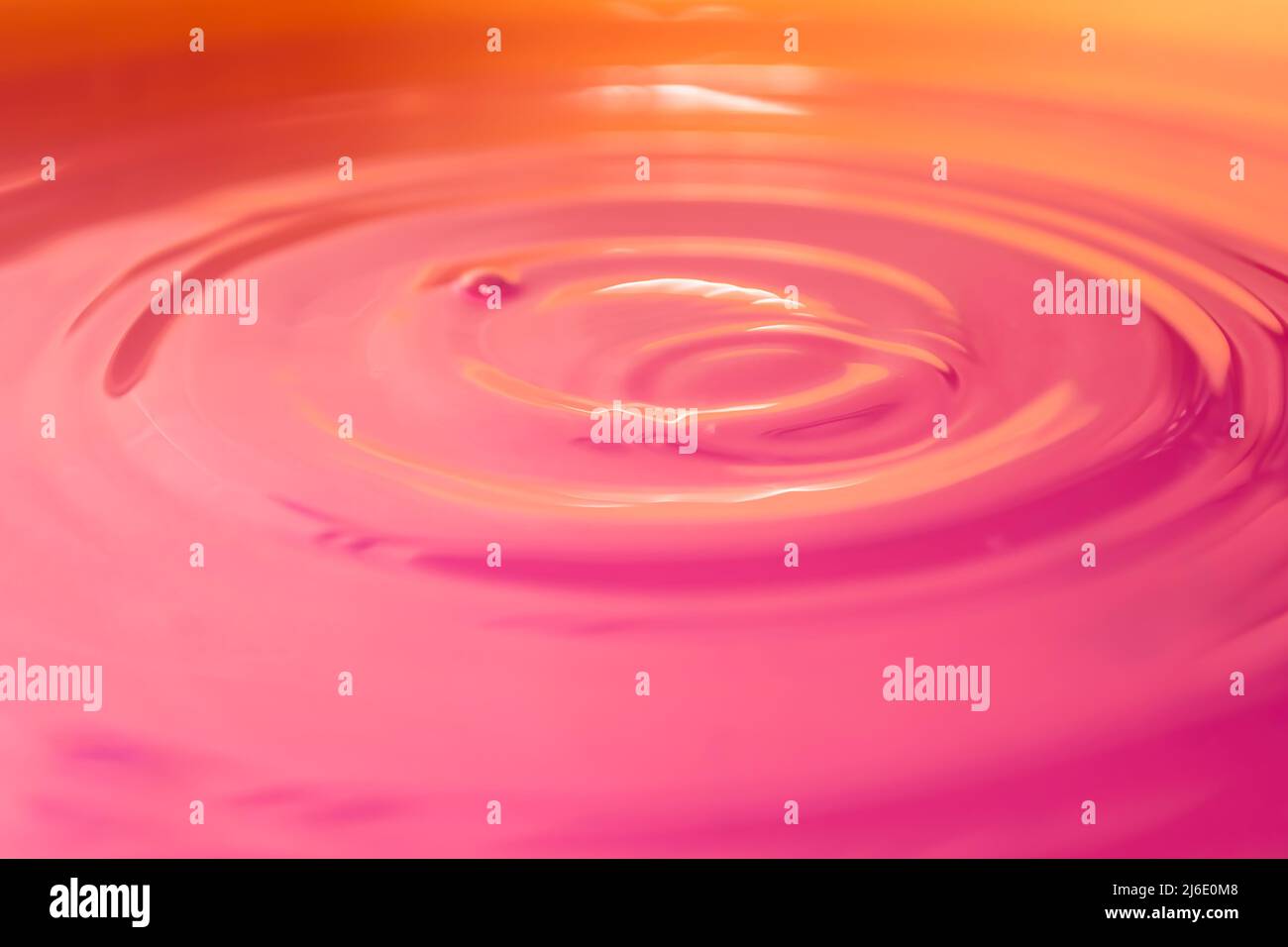 Pink strawberry milk cream yogurt with illuminated orange light ...