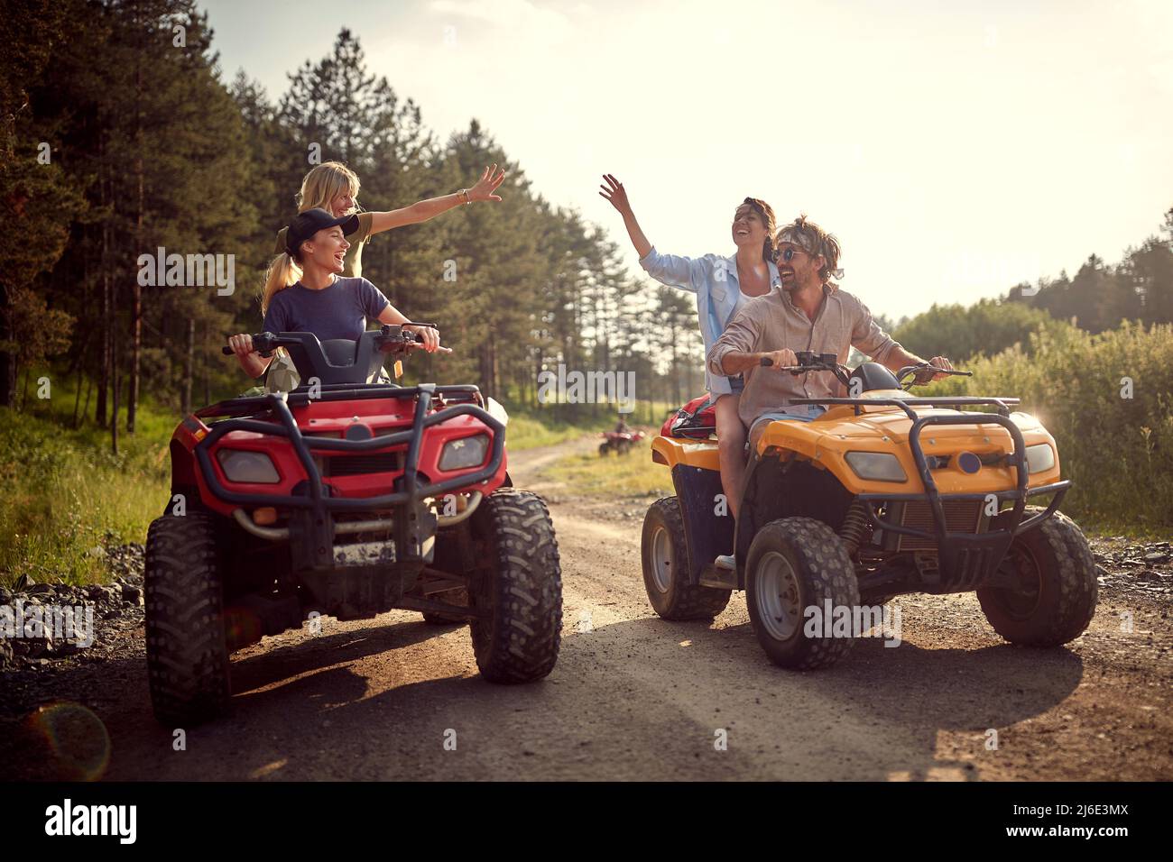 Group of traveler friends driving quads in the nature Stock Photo - Alamy