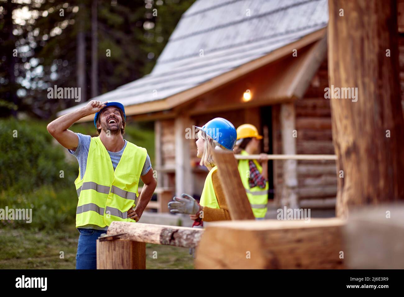 Young construction workers socializing together on a break Stock Photo ...