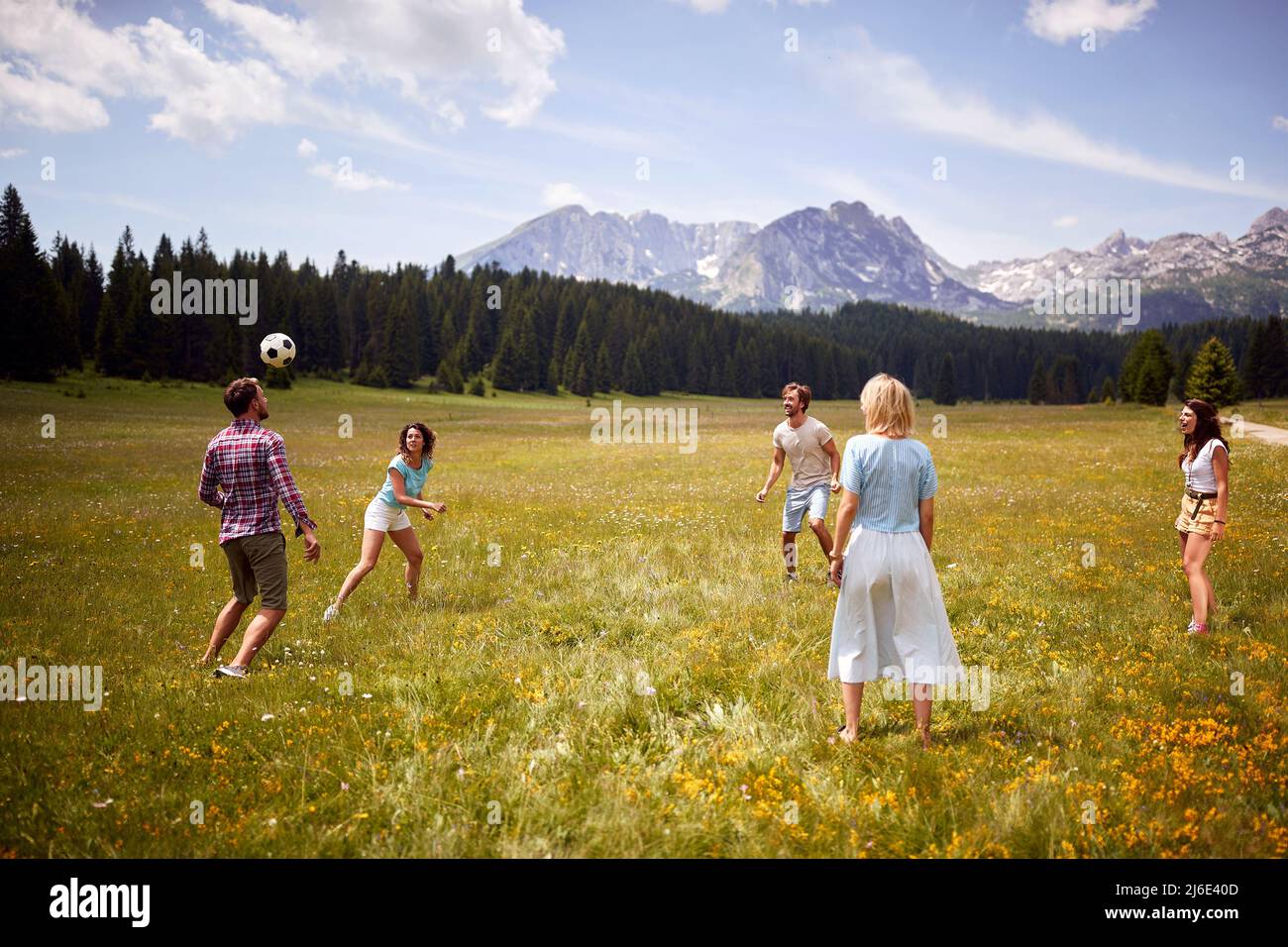 Group of friends playing with ball. sport outdoors of a group of people ...