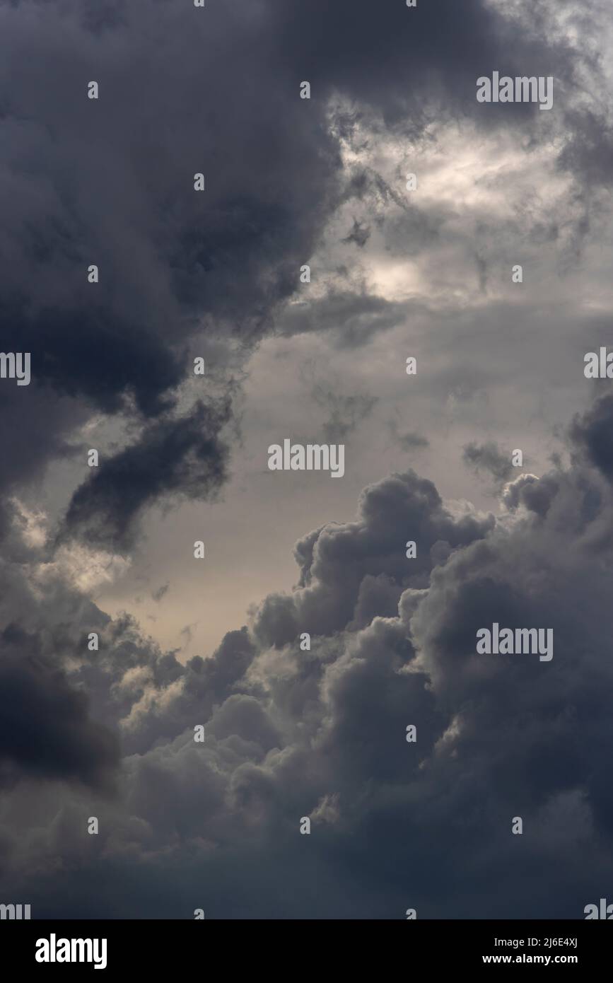 Dark storm clouds opening light hi-res stock photography and images - Alamy