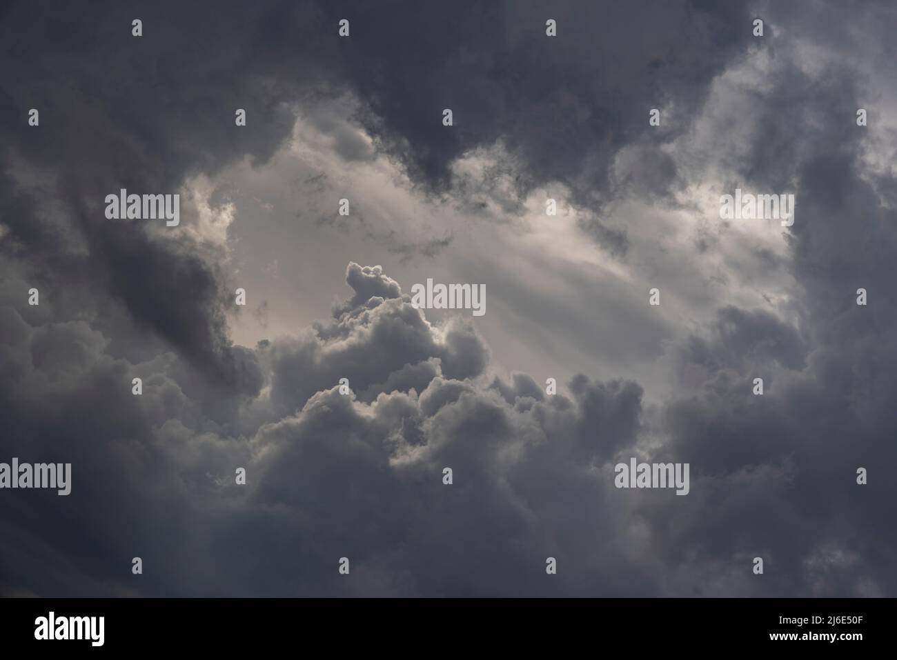 Dark storm clouds opening light hi-res stock photography and images - Alamy