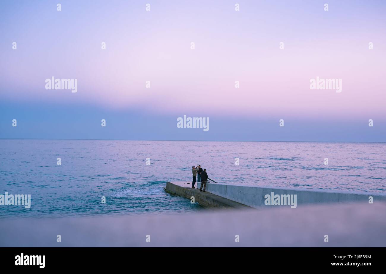 The main embankment of Yalta in the Crimea, fishermen catch fish Stock ...