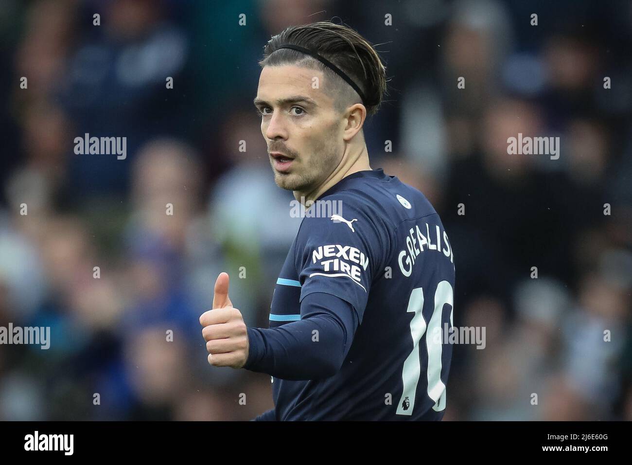 Jack Grealish #10 of Manchester City gives a thumbs up during the game ...