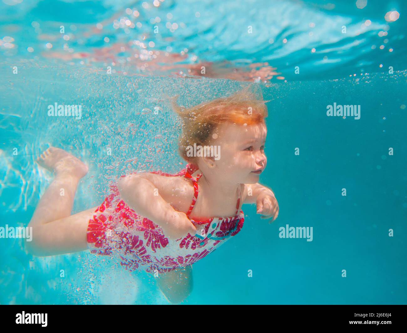 Girl diving underwater hi-res stock photography and images - Alamy