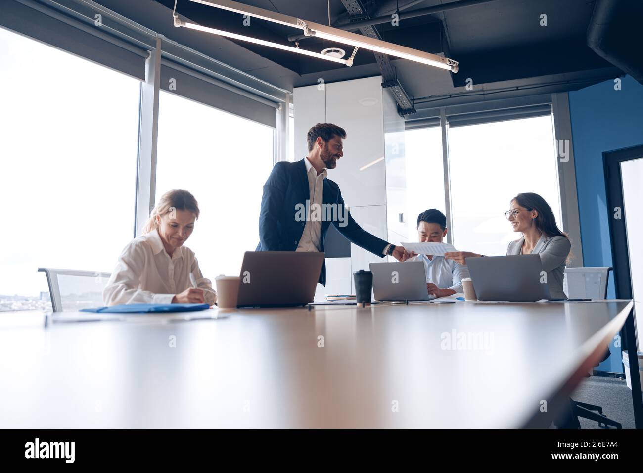 Creative business team working on new project in modern office with ...