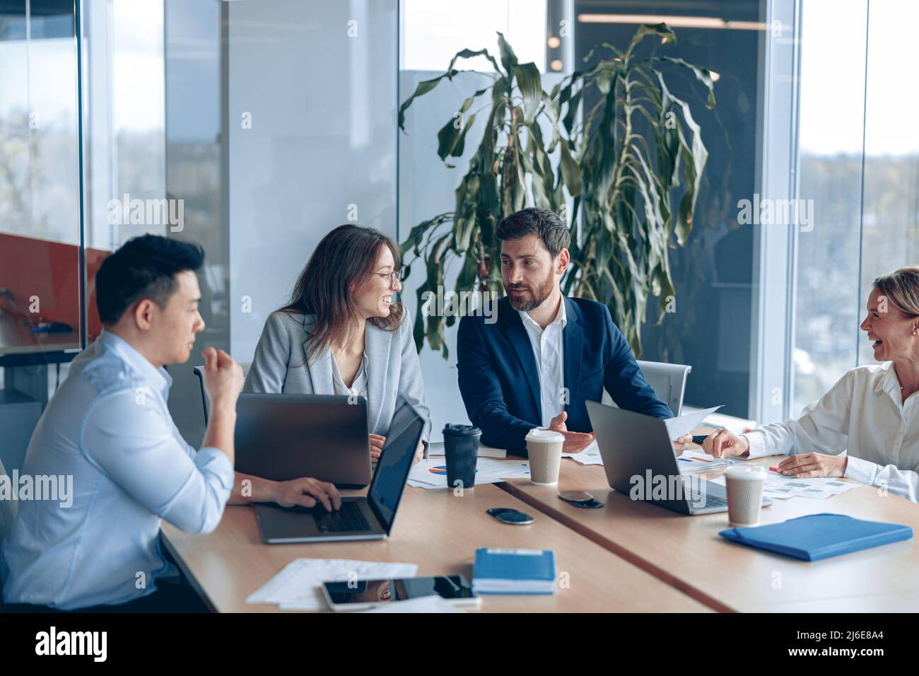 Creative business team working on project in modern office with ...