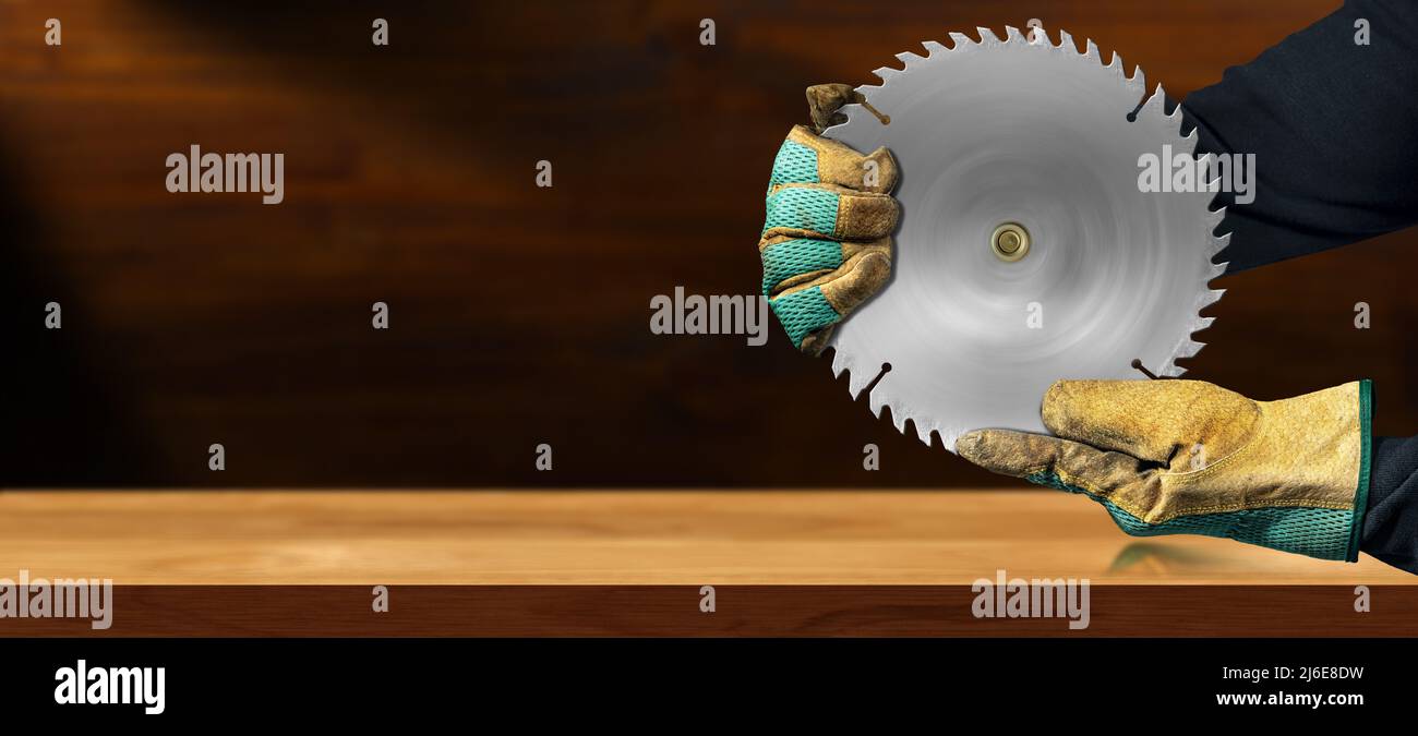 Carpenter with protective work gloves holding a metal circular saw ...