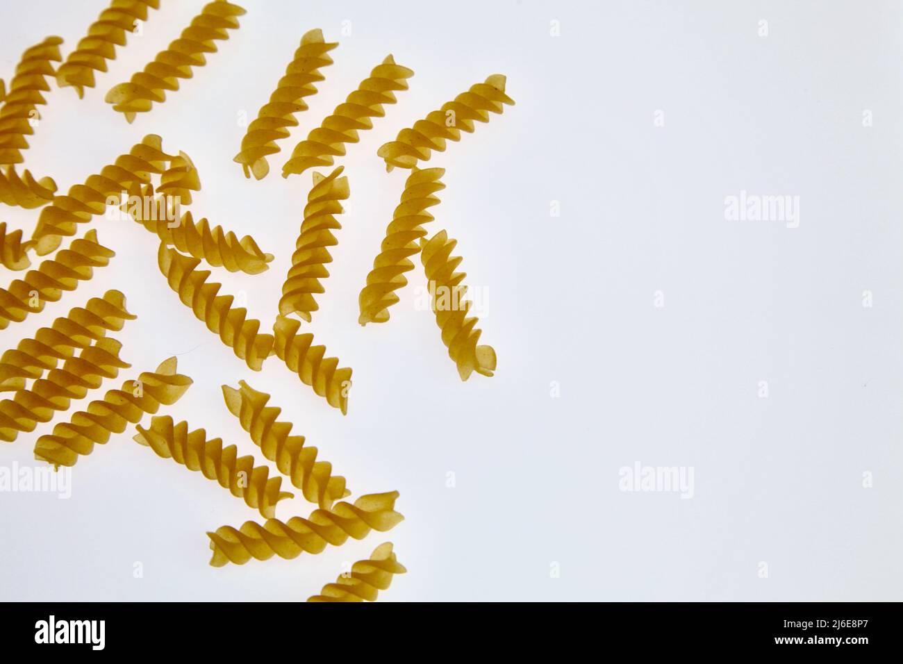 Dry pasta spaghetti and fusilli on white background May 2022 Stock ...