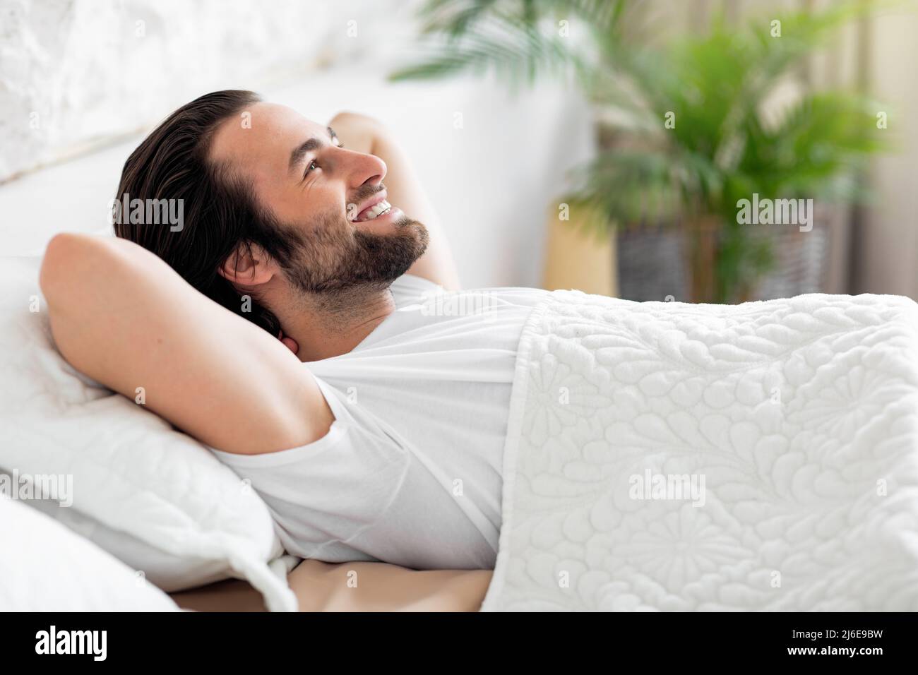 Man relaxing in bed hi-res stock photography and images - Alamy